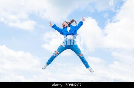 happy energetic kid feeling free and jumping high, success Stock Photo - Alamy