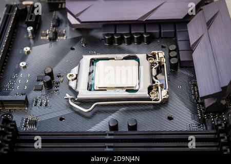 Closeup detail of CPU Chip over socket of a modern computer black ...