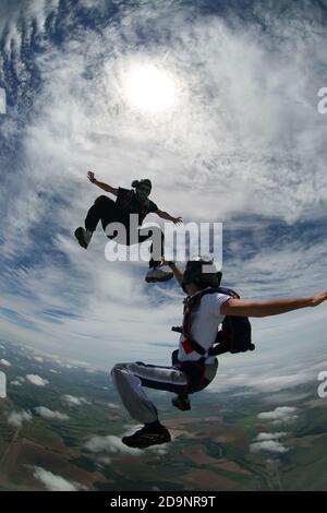 Two skydiver having fun at the skies Stock Photo - Alamy