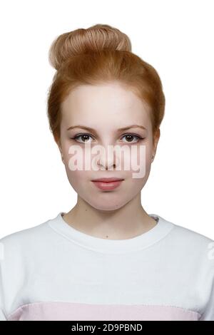 A 16 year old pretty caucasian girl shows a facial expression of shock ...