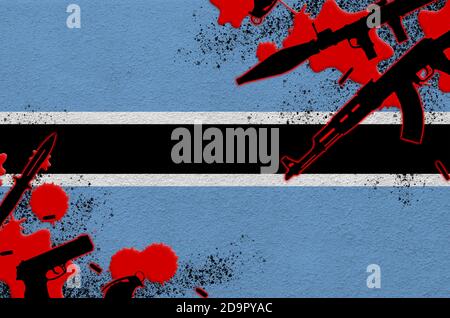 Botswana flag and various weapons in red blood. Concept for terror ...