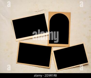old empty photo frames, vintage blank photographic prints on wood with ...