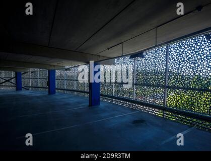 Perforated metal cladding panels at multi-storey parking garage ...