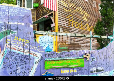 Homeowner's graffiti that he put up on his own home and fence Stock ...