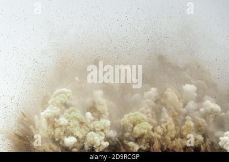 Flying rock and dust storm after detonator blast on the mining site ...