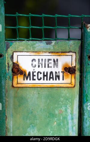 CAUTION text written on green zig-zag stamp sign Stock Photo - Alamy