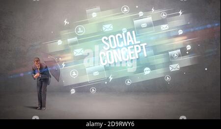 businessman defending with umbrella from social media Stock Photo - Alamy