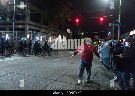 Seattle, USA. 5th Nov, 2020. Late in the night protestors police face ...