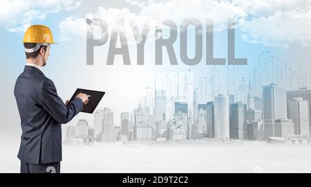 Young businessman with hard hat and PAYROLL inscription, new business ...