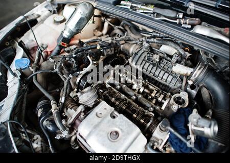 Car repair and maintenance theme. Open hood engine in auto service ...