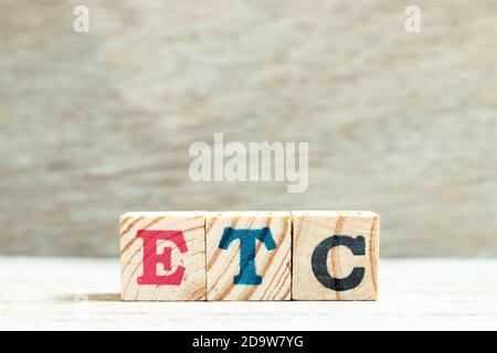 Alphabet letter in word etc (abbreviation of et cetera) on wood ...