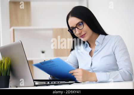 Multi-tasking and demanding work, the lady works Stock Photo - Alamy