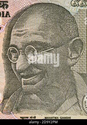 Closeup portrait of Mahatma Gandhi on India old rupee currency banknote ...