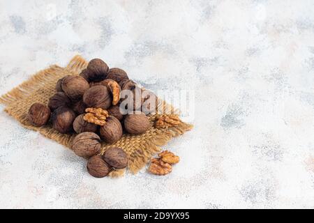 Walnuts. Contains beneficial vitamins and minerals. On a gray ...