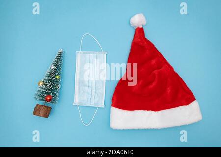 Christmas santa hat on a protective coronavirus face mask Stock Photo ...