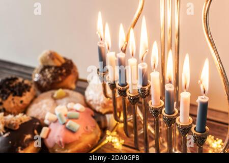 Closeup shot of a burning Menorah lampstand in celebration of Hannukah ...