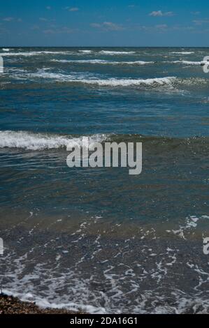 Closeup of sea frothy waves rushing towards the shore, scenic ...