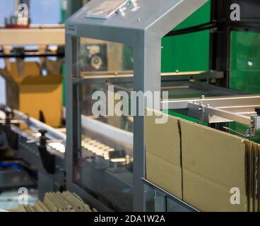 Process of carton forming machine in production line Stock Photo - Alamy