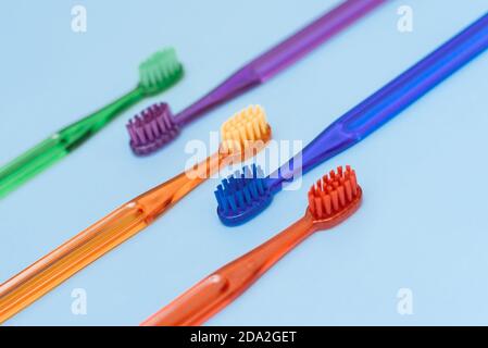 Toothbrushes on blue background. Taking care of teeth, dental concept ...