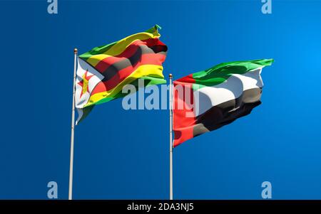 Zimbabwe and United Arab Emirates, UAE flag waving together in the wind ...