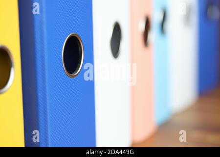 Stack of multi-colored folders is on the table Stock Photo - Alamy