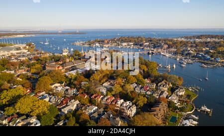 Aerial view of colorful sailboat moorings, docks, and bright golden ...