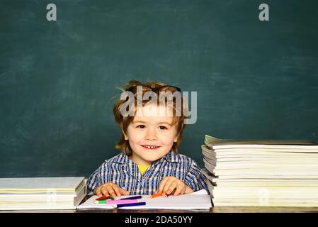 Young schoolchild pointing up portrait. Preteen schoolgirl looking at ...