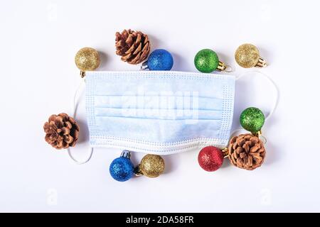 Face mask and festive decorations on the New Year background. Corona ...