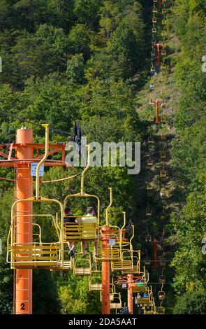 The colorful Gatlinburg Sky Lift Scenic Chair-lift Ride with people ...