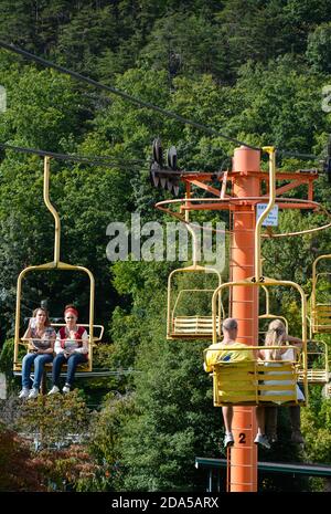 The colorful Gatlinburg Sky Lift Scenic Chair-lift Ride with people ...
