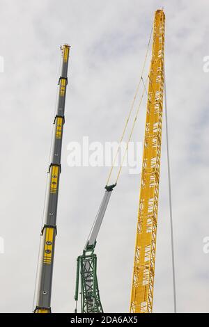 Telescopic Cranes Under A White Sky Construction Engineering Industry