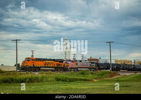orange BNSF American freight trains from bridge above railway tracks ...