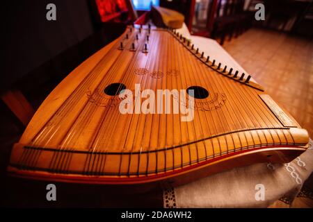 Old vintage wooden carved Gusli Russian folk instrument, close up view ...