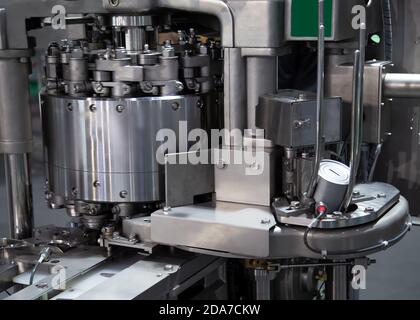 High speed can seamer machine. Tin can sealing machinery. Food industry ...