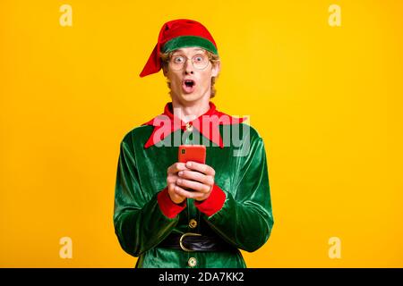 Photo of amazed elf guy hold spoon fork x-mas christmas party feast ...