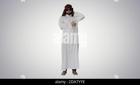 Cool sheikh in sunglasses posing on white background Stock Photo - Alamy