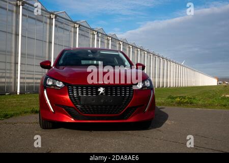 2020 Peugeot 208 in the metallic color rouge elixir Stock Photo - Alamy