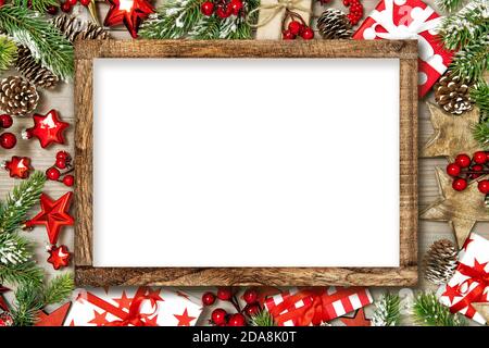 Christmas frame of ornaments, branches and red and black checked ...