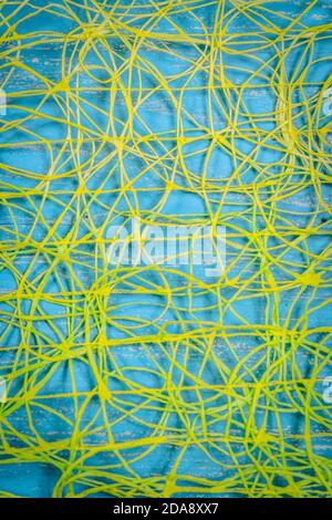 Sewing threads on grey textured background Stock Photo - Alamy