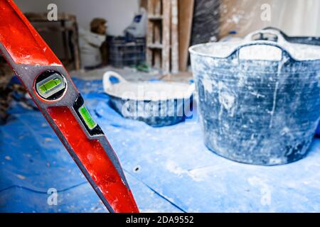 Level and other masonry tools in a renovation work Stock Photo - Alamy