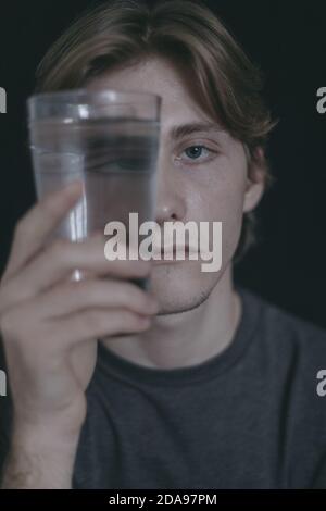 a very lonely guy at home suffers from the fact that he is alone and ...