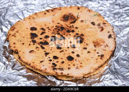 Indian flatbread tandoori roti and Malai kofta curry made in tandoor ...