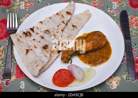 Indian flatbread tandoori roti and Malai kofta curry made in tandoor ...