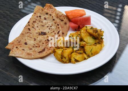 Indian flatbread tandoori roti and Malai kofta curry made in tandoor ...