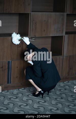 Mourner crying with flowers at funeral Stock Photo - Alamy