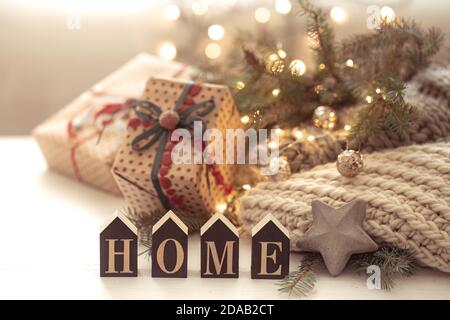 Cozy winter composition with decorative word home and paper christmas ...