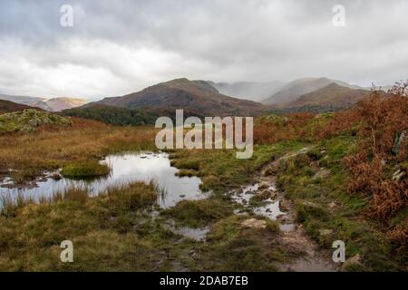 The mountains and hills are surrounded by mist and cloud along the Li ...