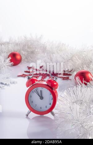 Alarm clock on the snow covered winter spruce Stock Photo - Alamy