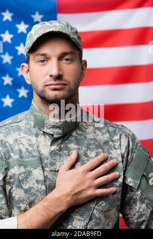 An American soldier man pledging allegiance in front of his country's ...
