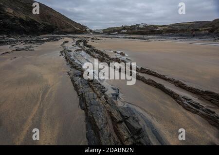 Alternating bands of sandstones and shales form the steep sides and ...